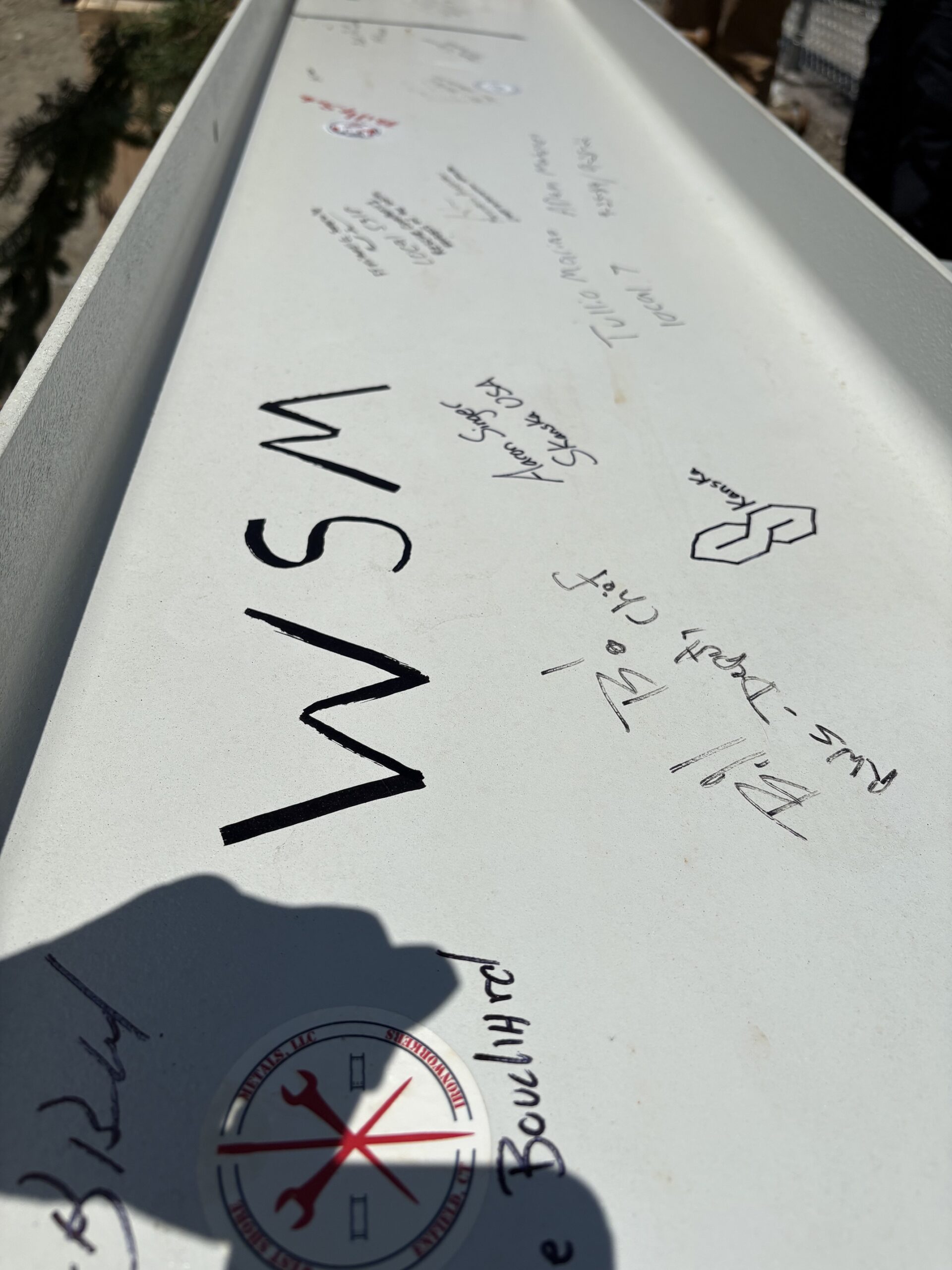 Beam me up: Lee stakeholders celebrate as the final beam is placed atop ...